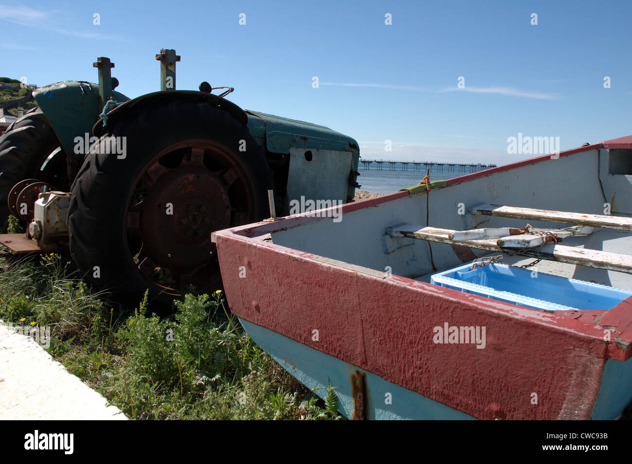 Old fashioned tractor and fishing boat on the beach at Saltburn by the ...