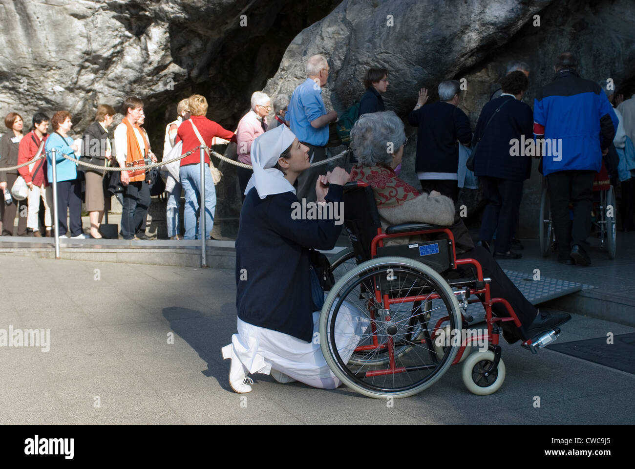 Believers pray lourdes france hi-res stock photography and images - Alamy