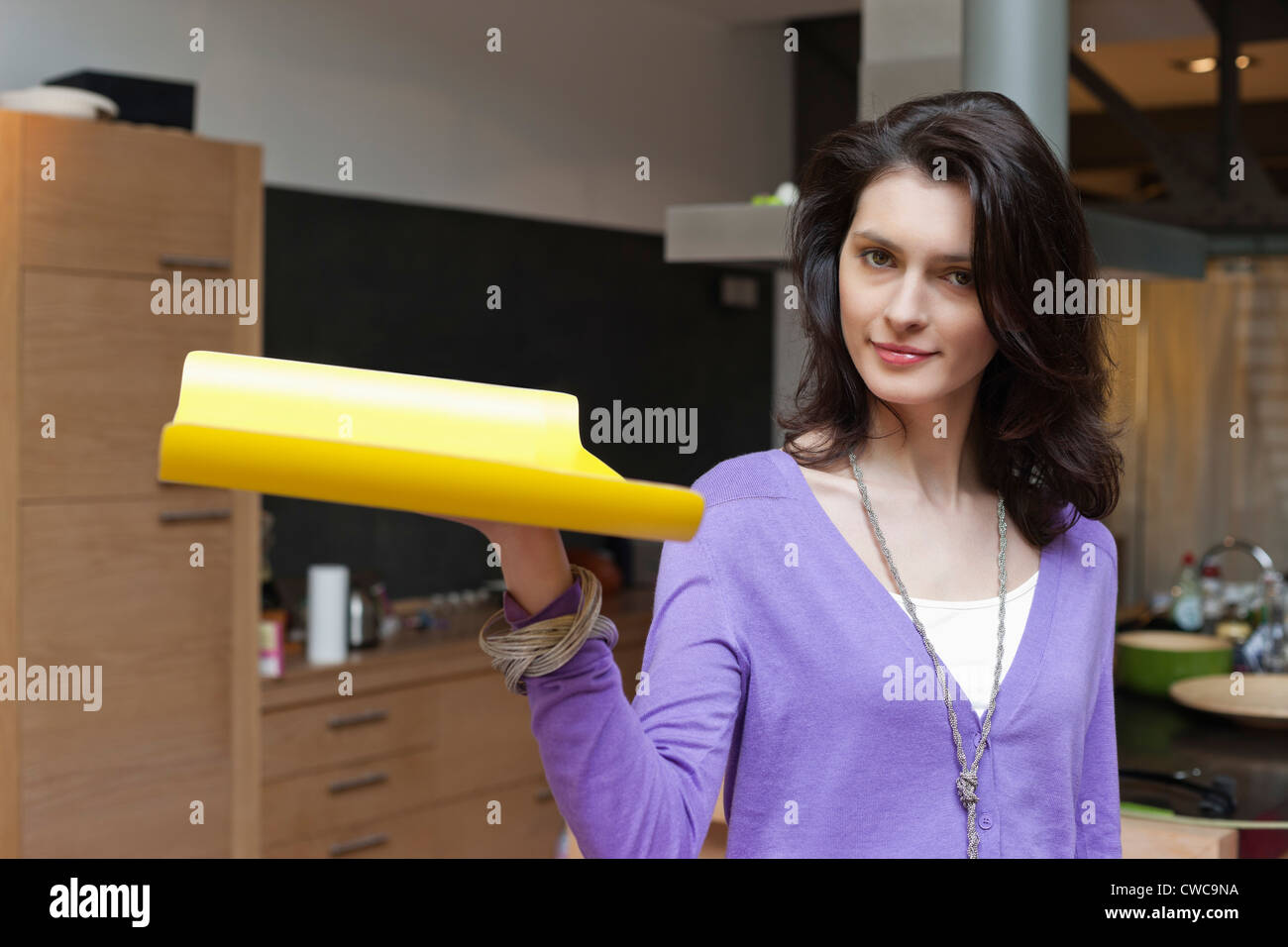 Woman carrying a tray Stock Photo - Alamy