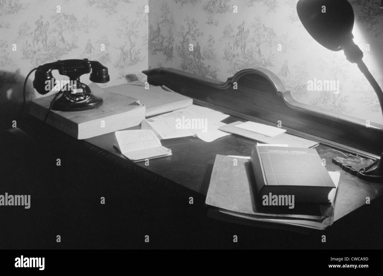 A US government clerk's home office desk with books, telephone and ...