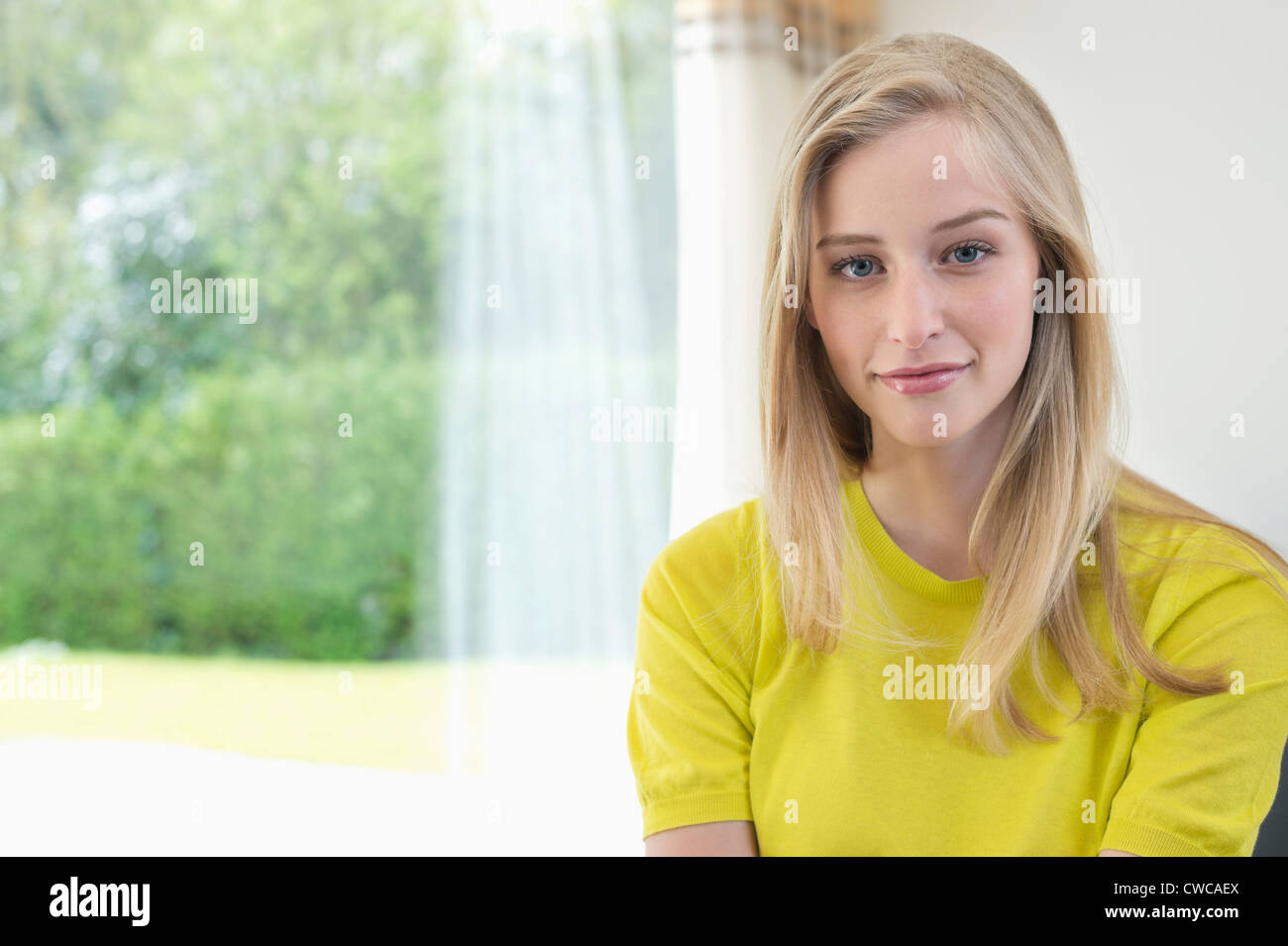 Portrait of a beautiful woman smirking Stock Photo - Alamy