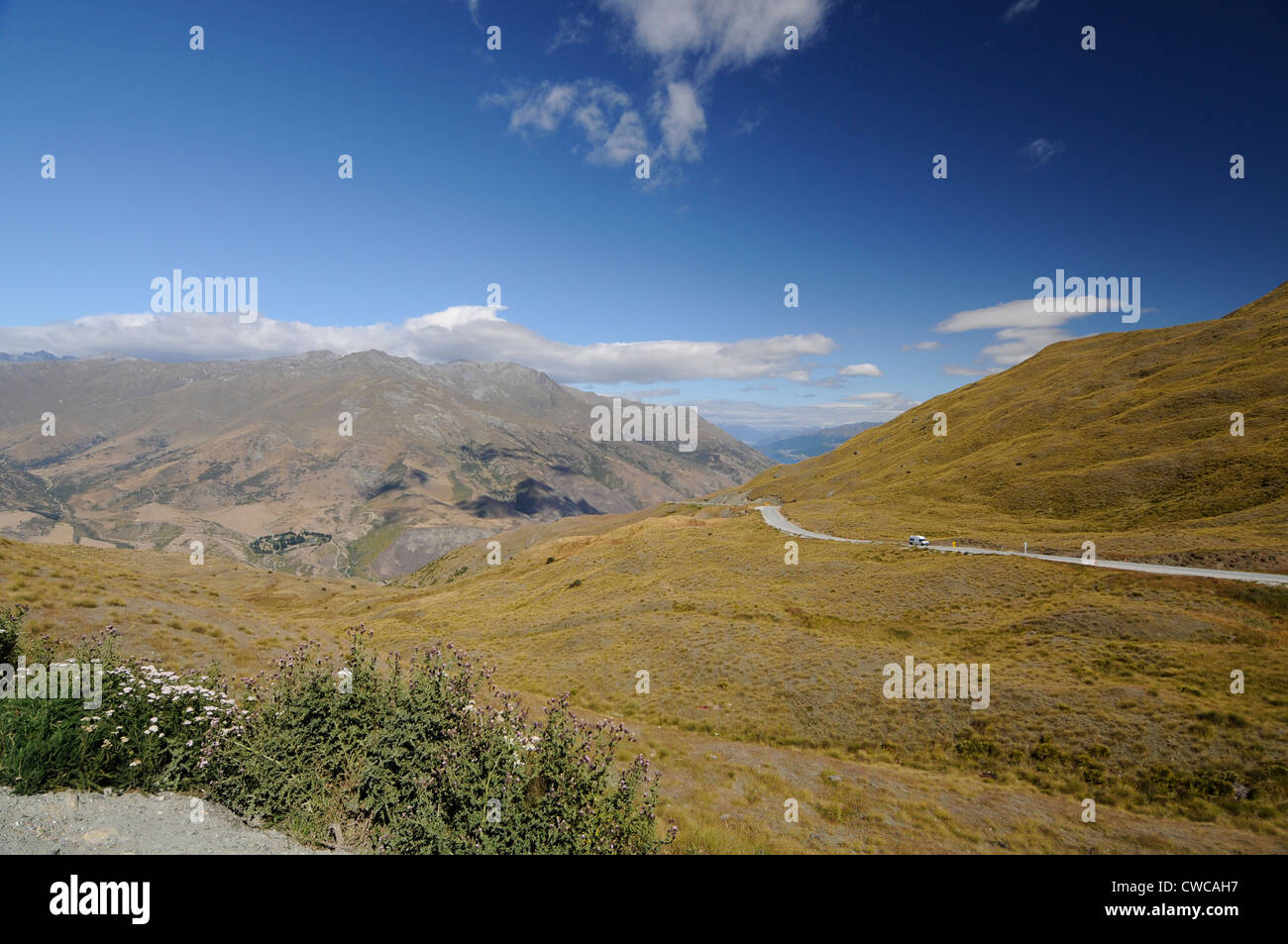 The Crown Range Road winds its way in the Crown Range mountains between ...