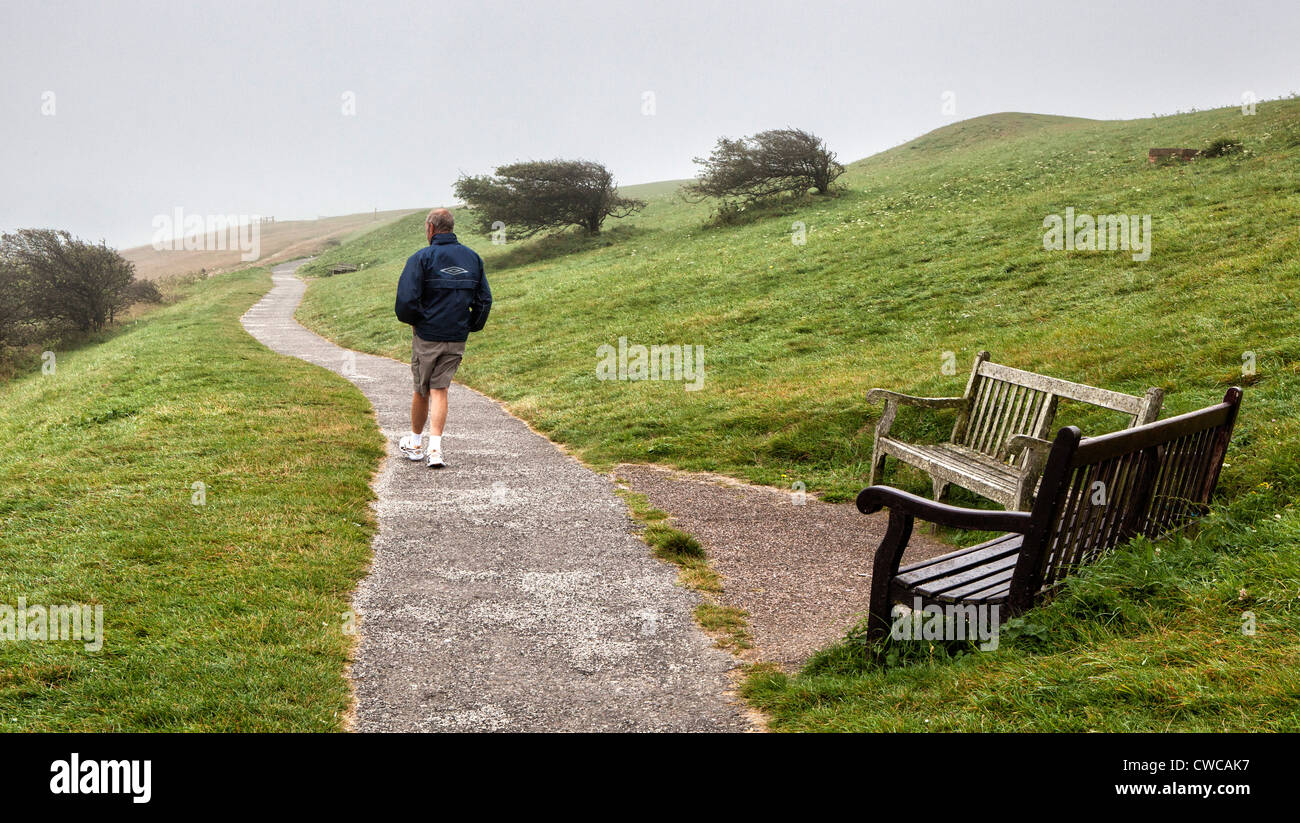 Man walking along the Peace Path at Beachy Head, the highest chalk ...