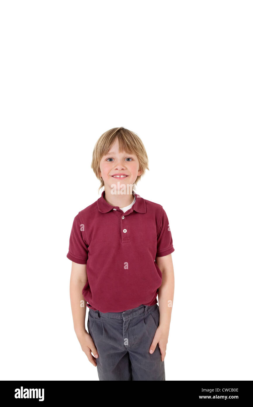 Portrait of happy elementary boy in school uniform over white ...