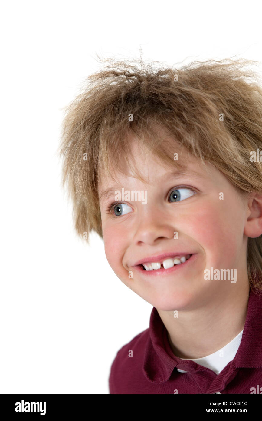 Close-up of blond boy looking sideways over white background Stock ...