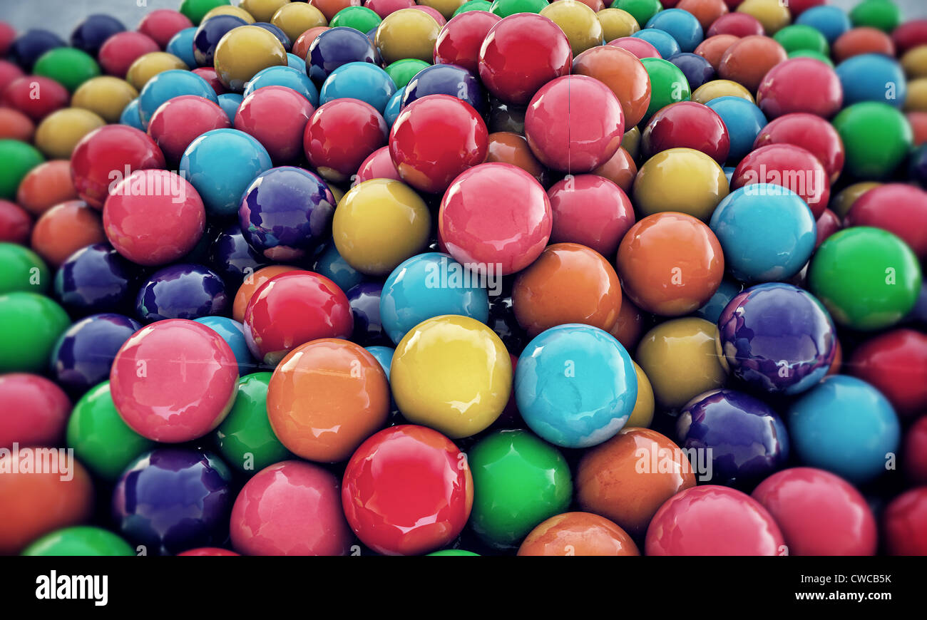 large group of gum balls on concrete floor Stock Photo - Alamy