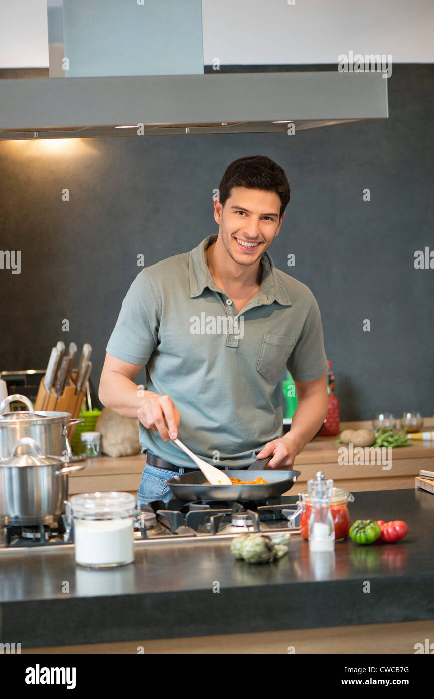 Man preparing food in the kitchen Stock Photo - Alamy