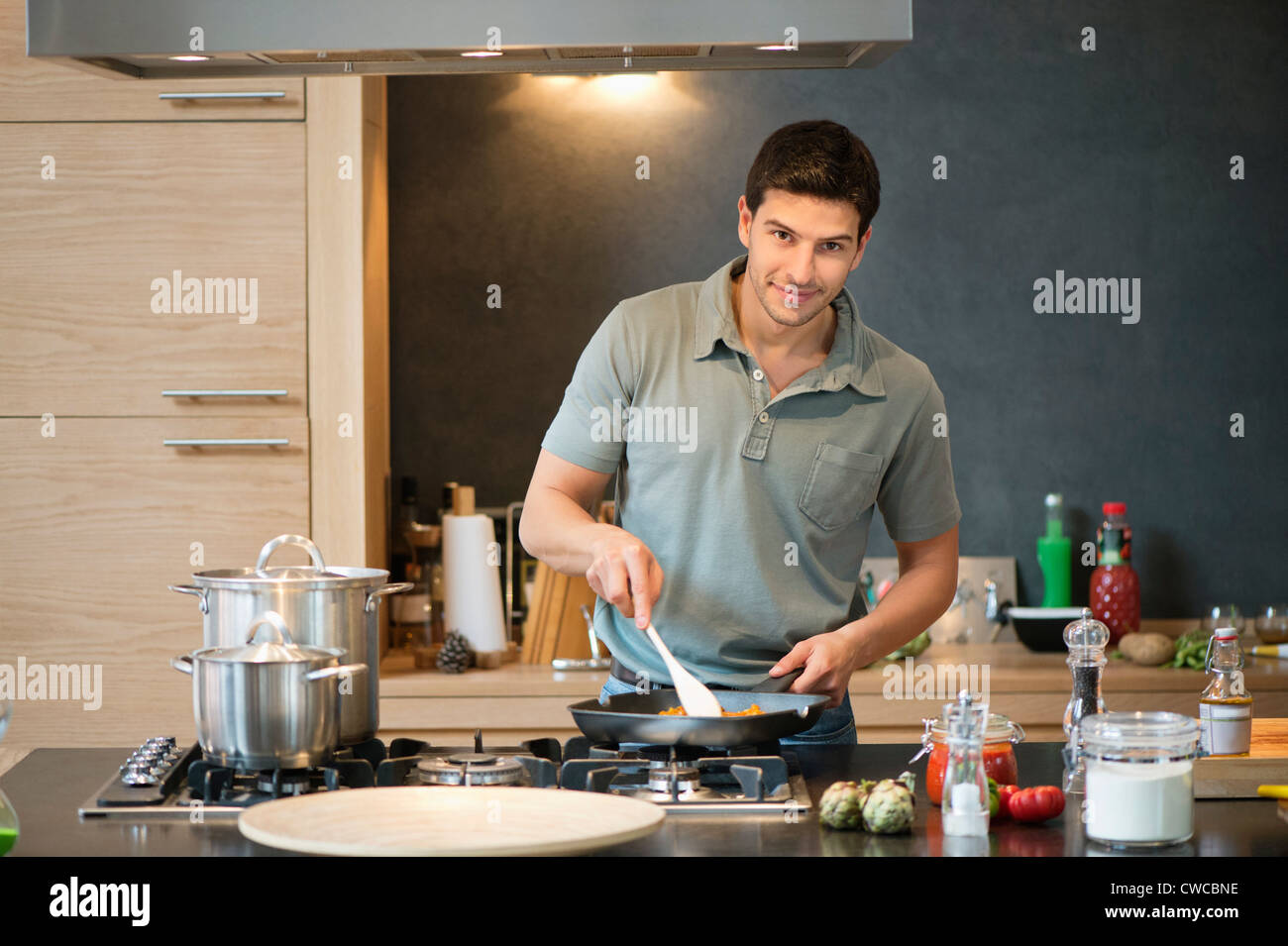 Man preparing food in the kitchen Stock Photo - Alamy