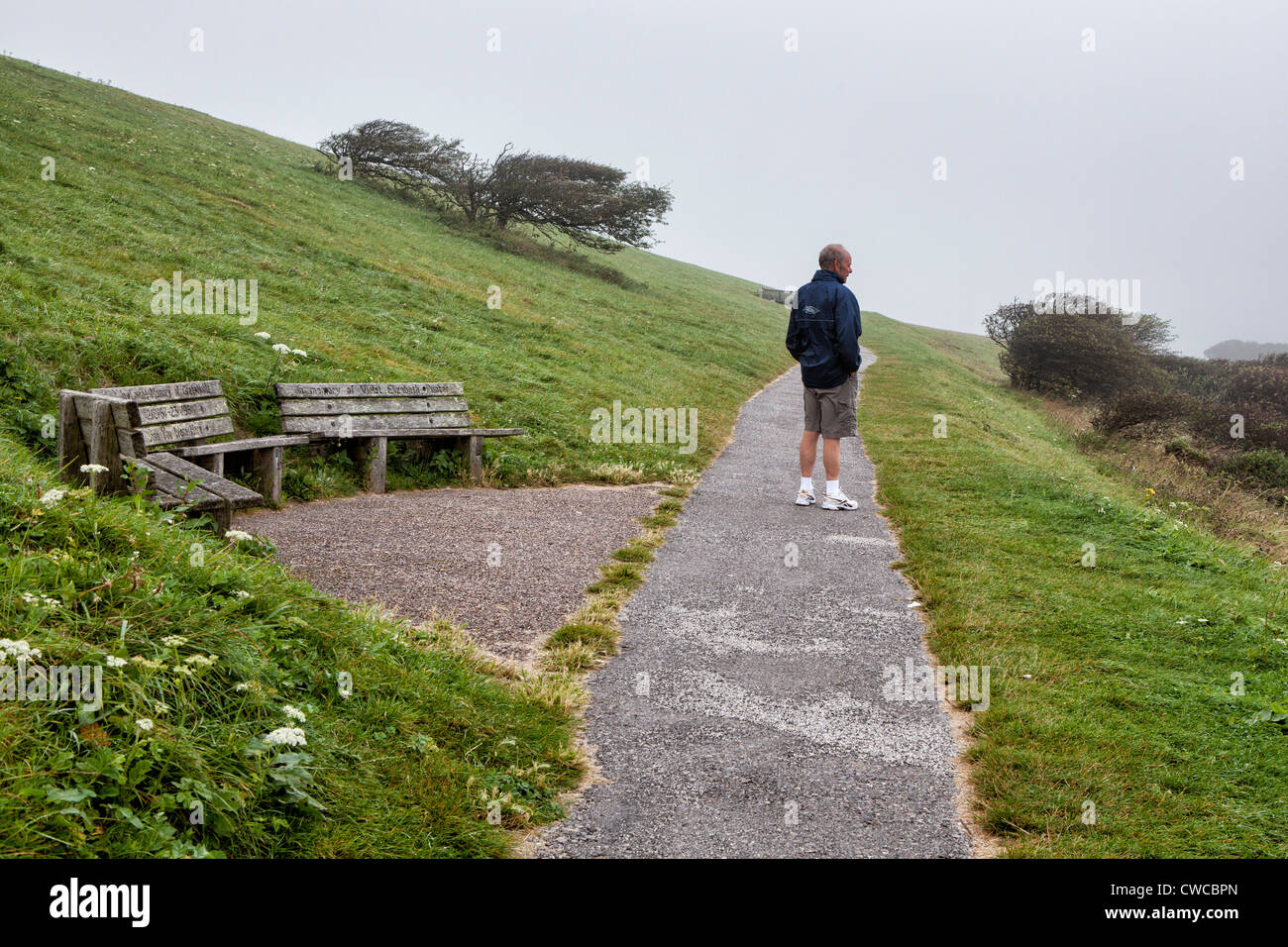 Man walking along the Peace Path at Beachy Head, the highest chalk ...