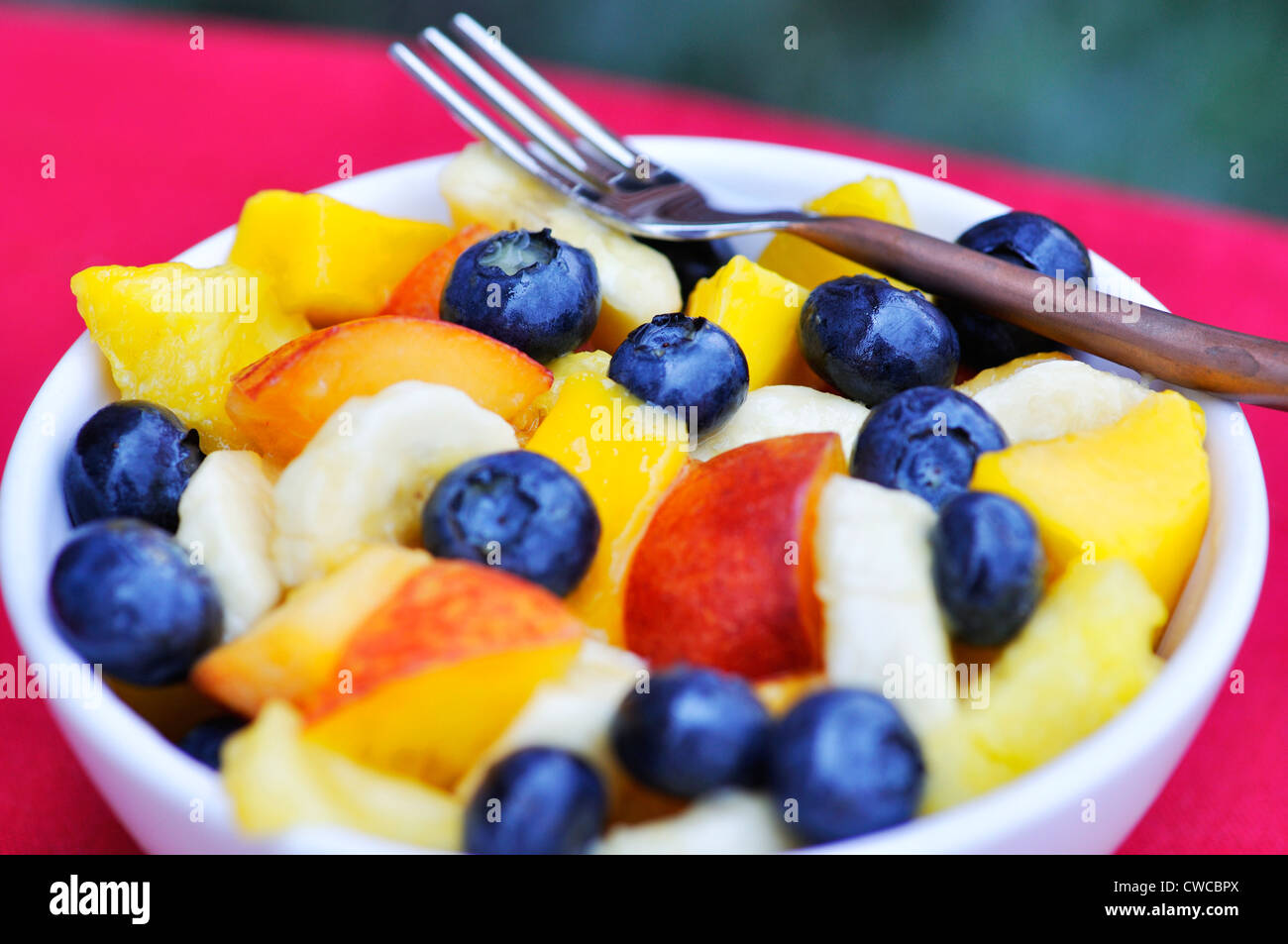 Fruit salad in bowl Stock Photo - Alamy