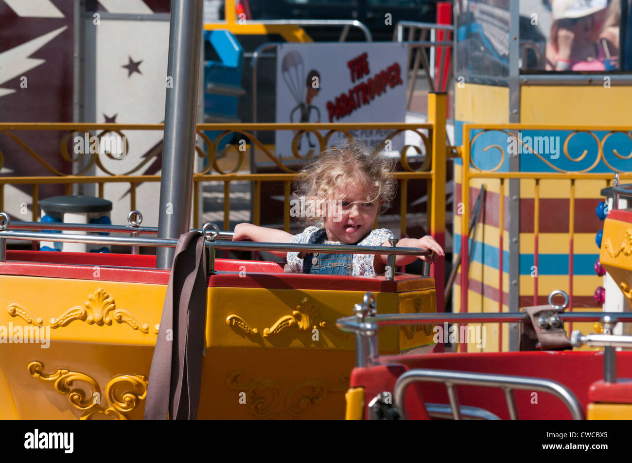 Little Girl Child On A Fairground Ride UK Stock Photo - Alamy