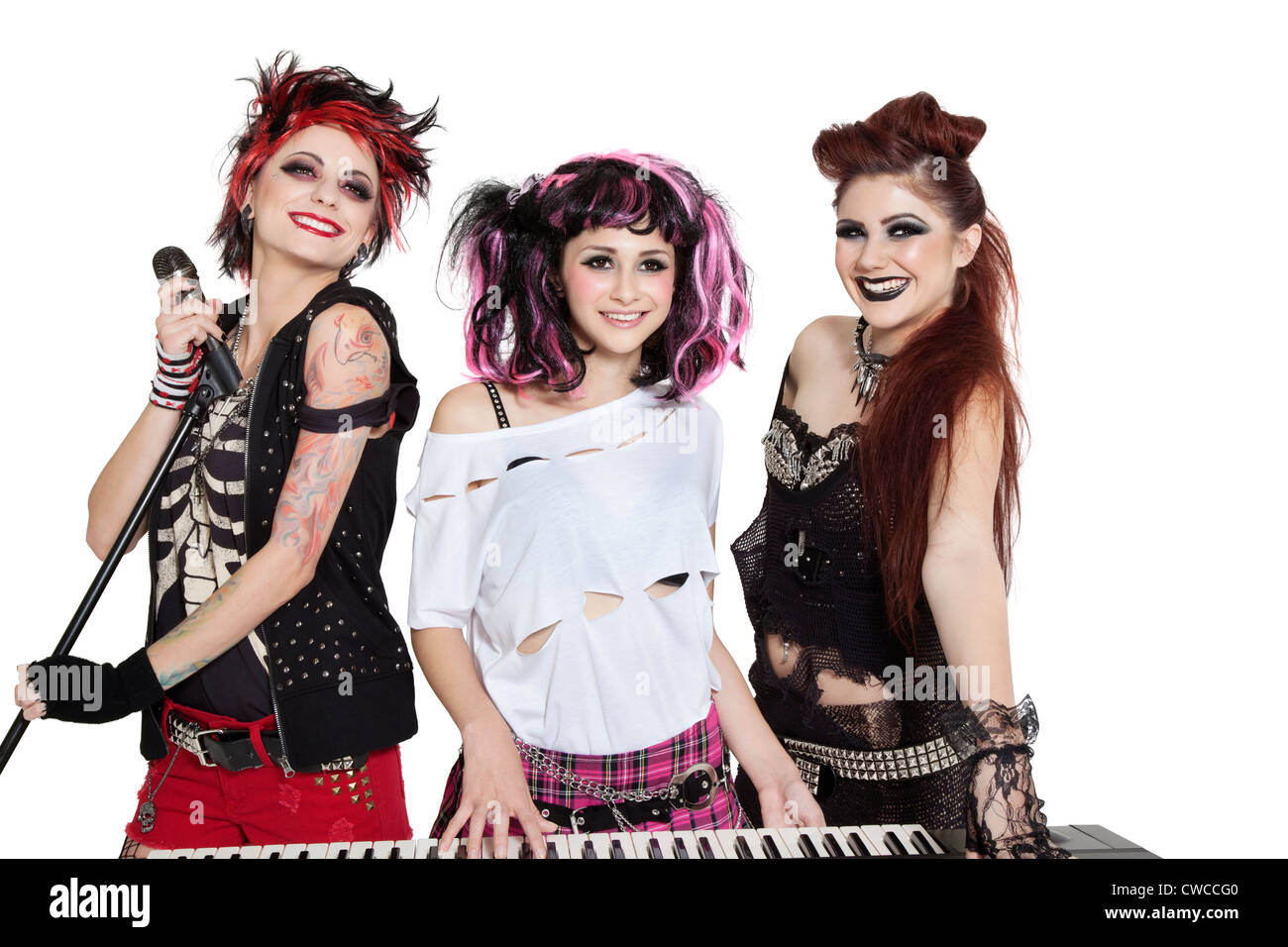 Beautiful young punk woman with piano and microphone over white ...