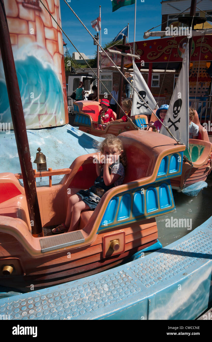 Children enjoying a funfair ride hi-res stock photography and images ...