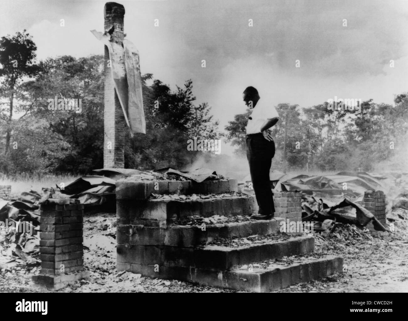 Pastor H.C. McClain looking over the burned ruins of his High Hope ...