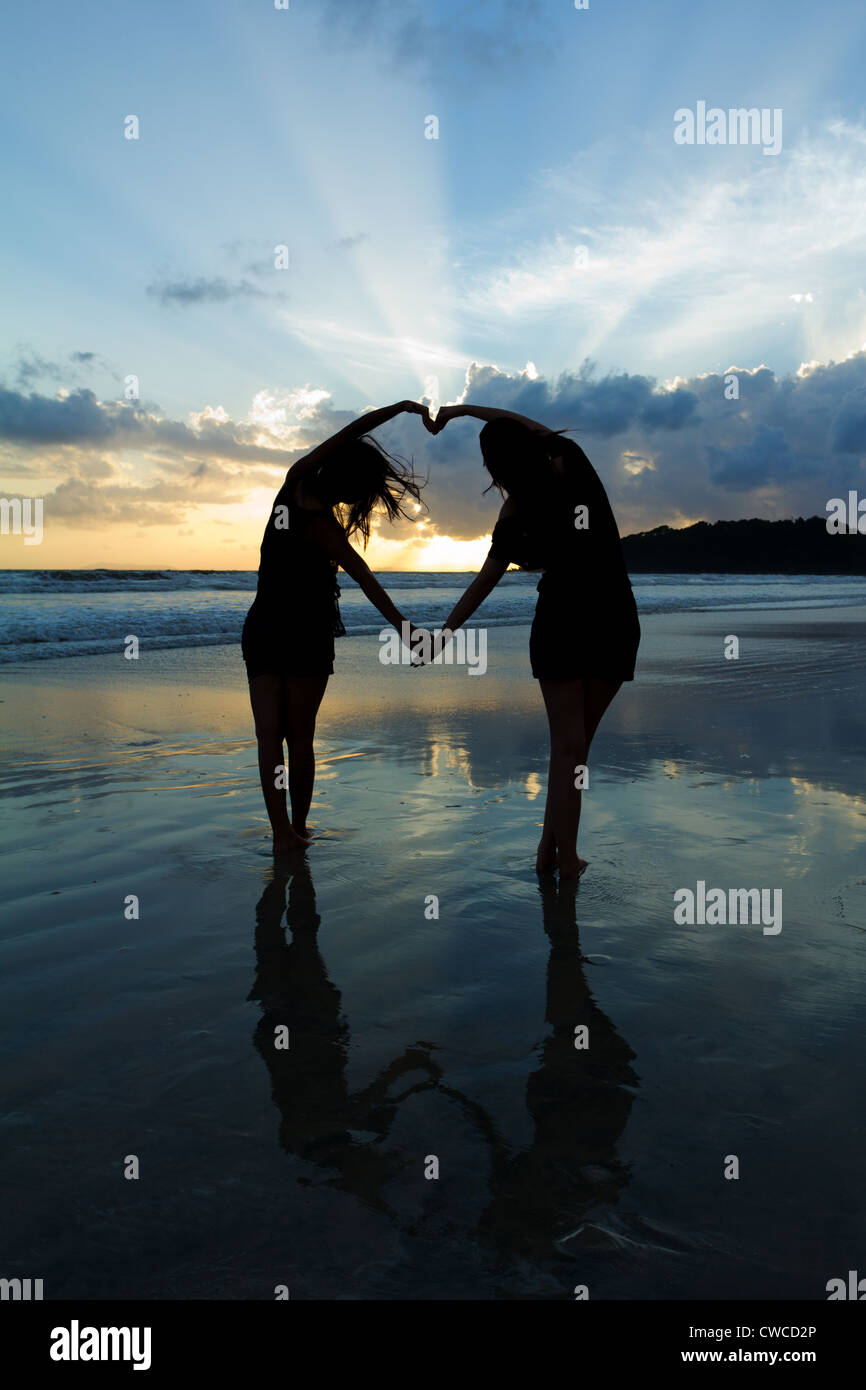 Girl making heart shape arms hi-res stock photography and images - Alamy