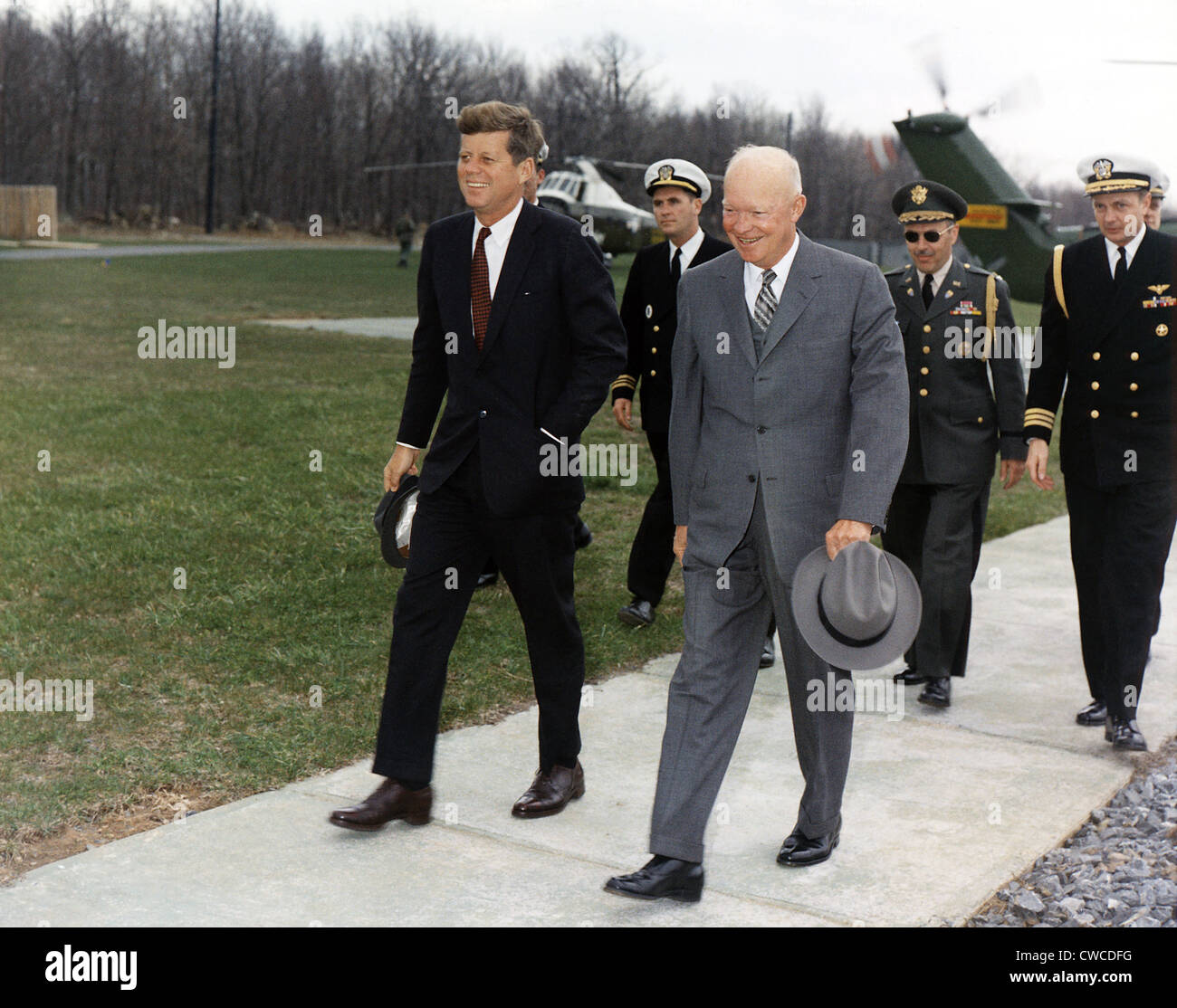 President Kennedy and former President Eisenhower walk ahead of ...