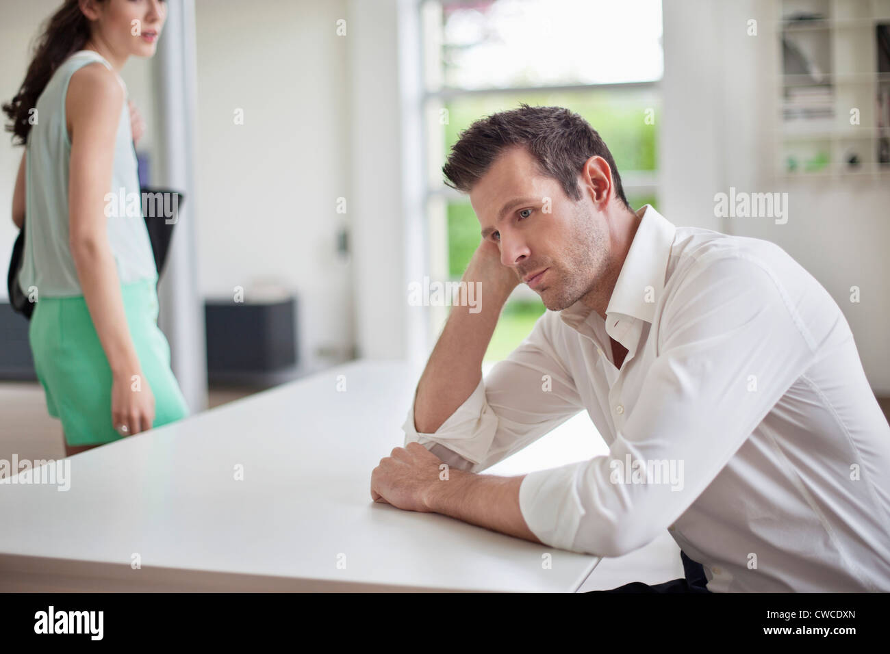Woman thinking table boyfriend hi-res stock photography and images - Alamy