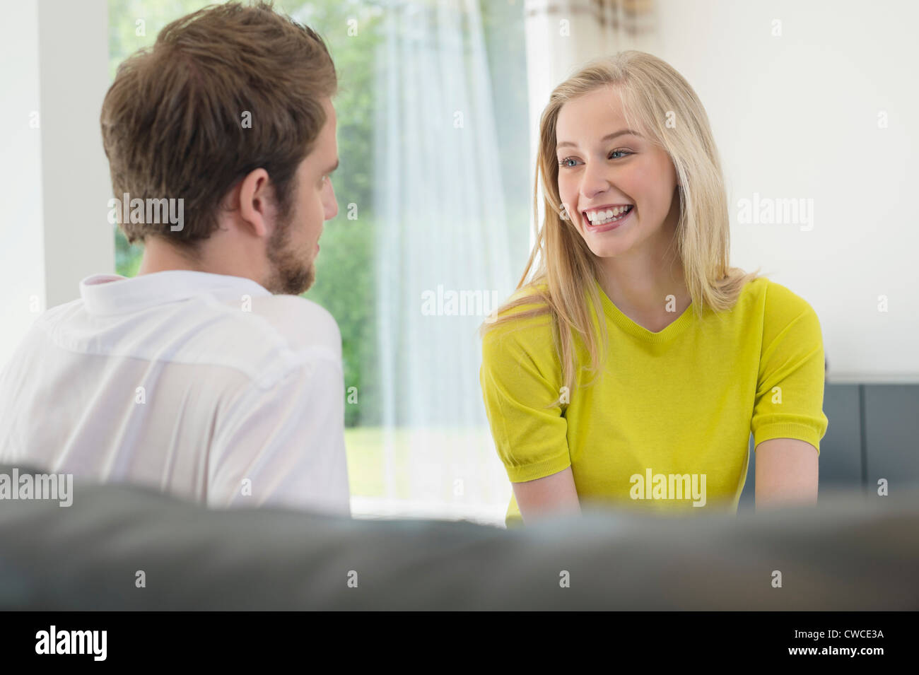 Couple talking together Stock Photo - Alamy