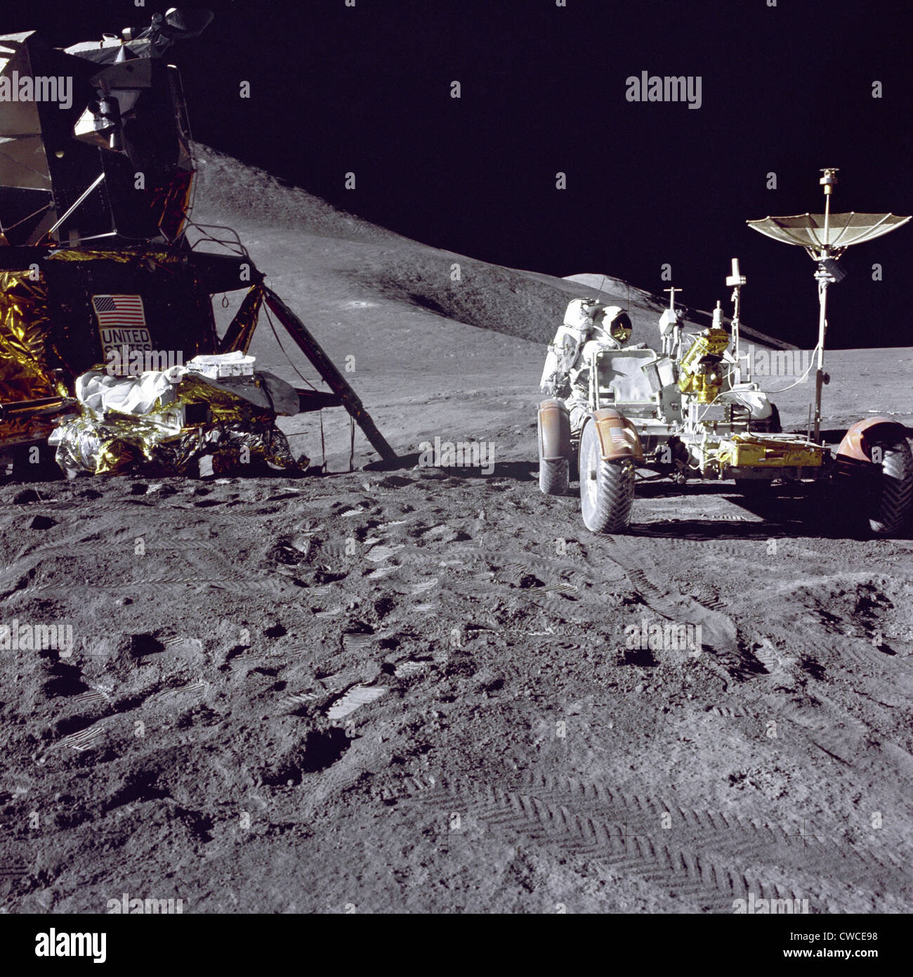 Apollo 15 astronaut James Irwin loads the Lunar Roving Vehicle with ...