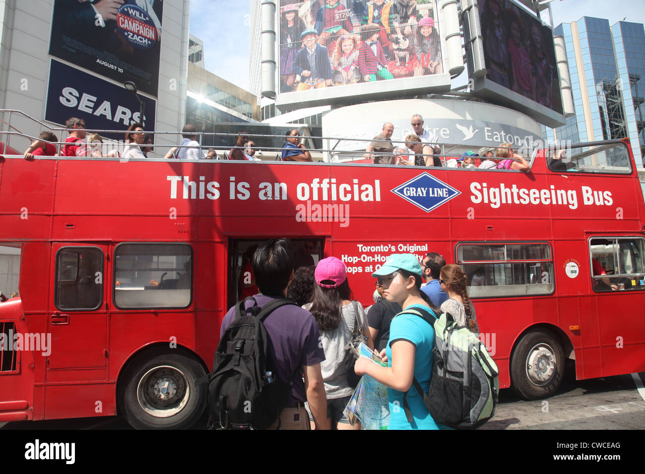 Tourists boarding a Toronto Sightseeing bus in front of Eaton Centre on ...