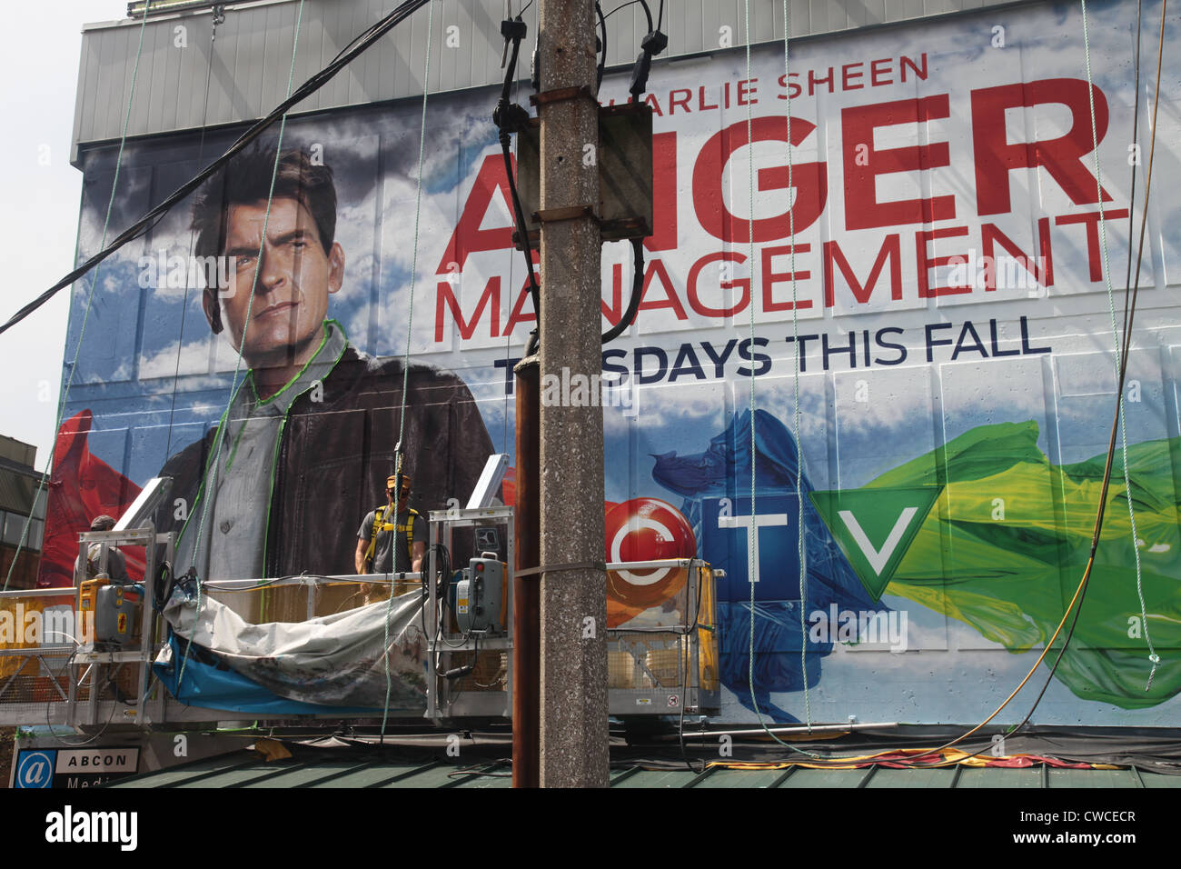 Workers putting up a big billboard in Toronto, Canada, 2012 august ...