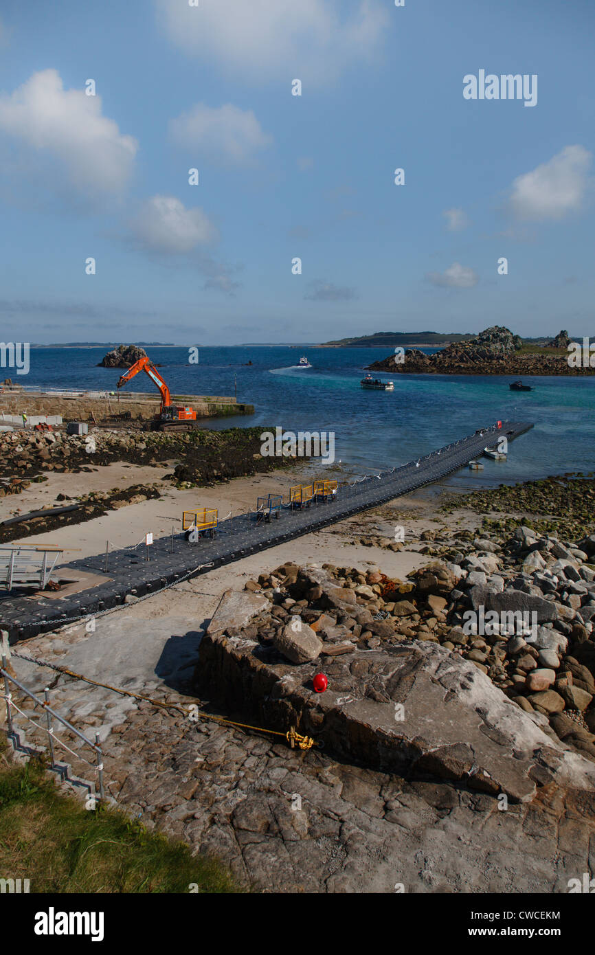 The temporary floating quay at St.Agnes Isles of Scilly with work on re ...