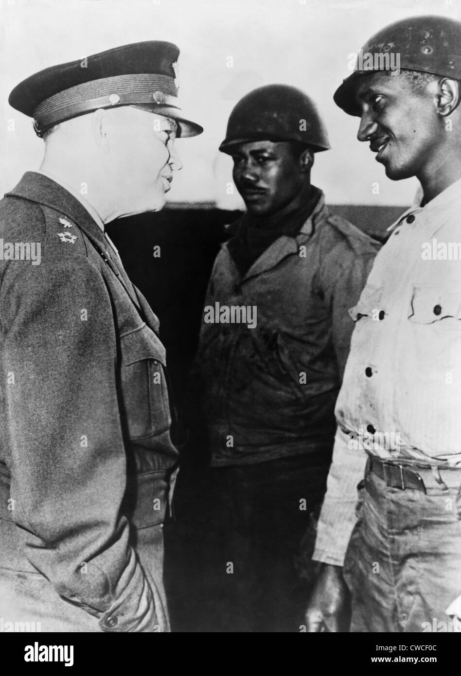 General Dwight Eisenhower talking with two African American soldiers at ...