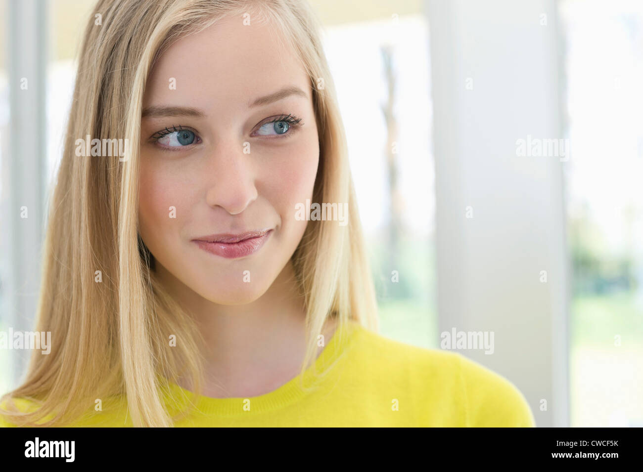 A beautiful woman smirking hi-res stock photography and images - Alamy
