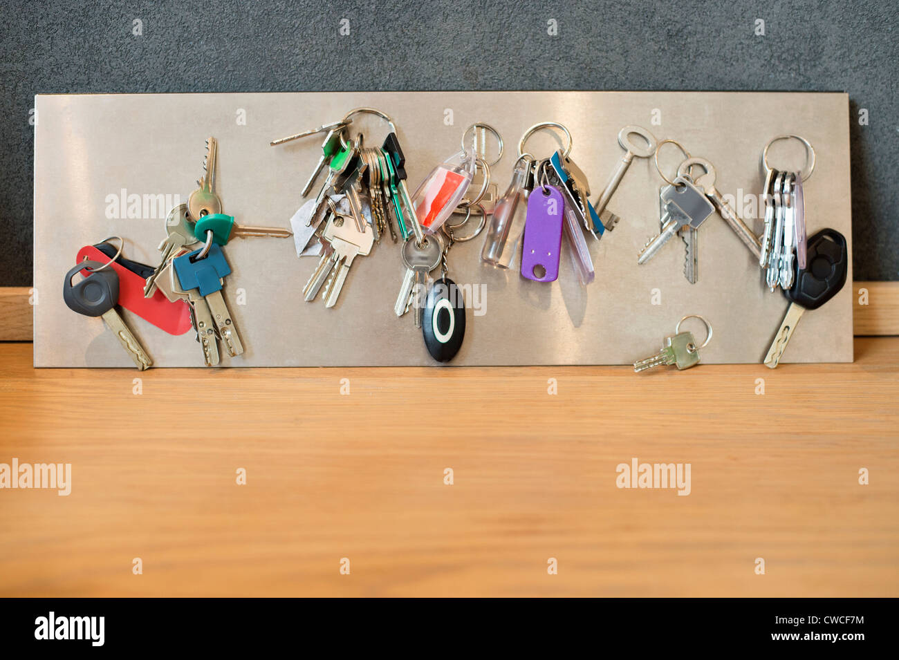 Assorted keys on a metal sheet Stock Photo - Alamy