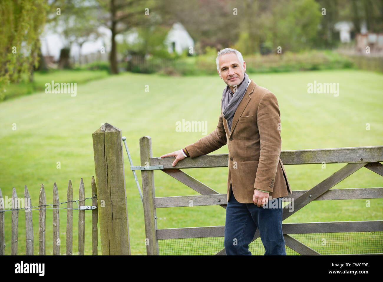 Portrait of a man standing in a park Stock Photo - Alamy