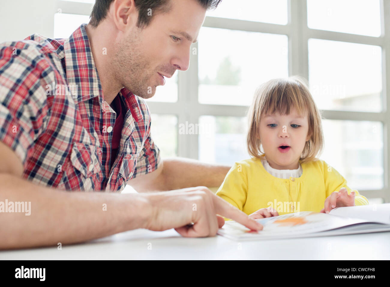 Man teaching his daughter Stock Photo - Alamy