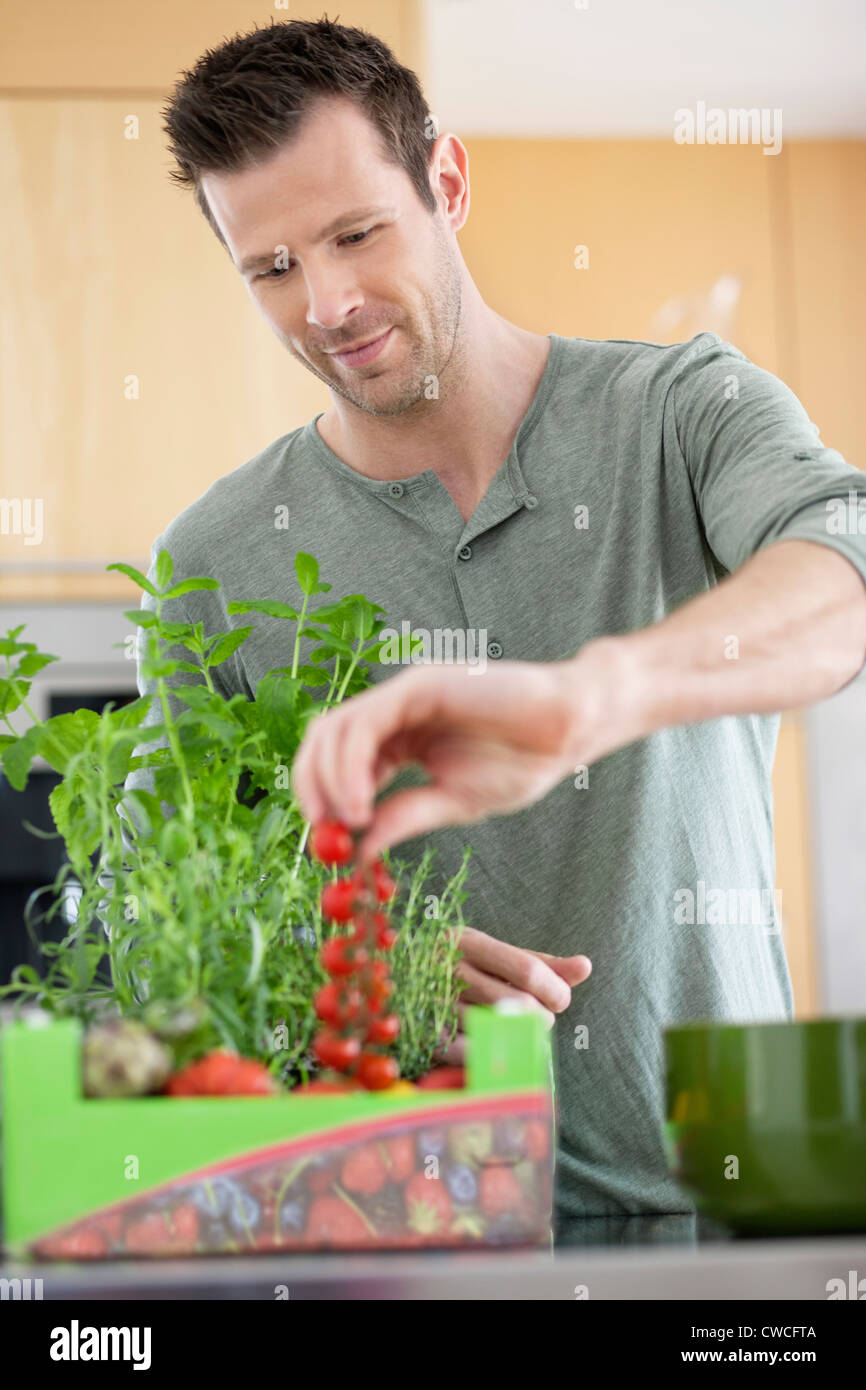 Man preparing food in the kitchen Stock Photo - Alamy