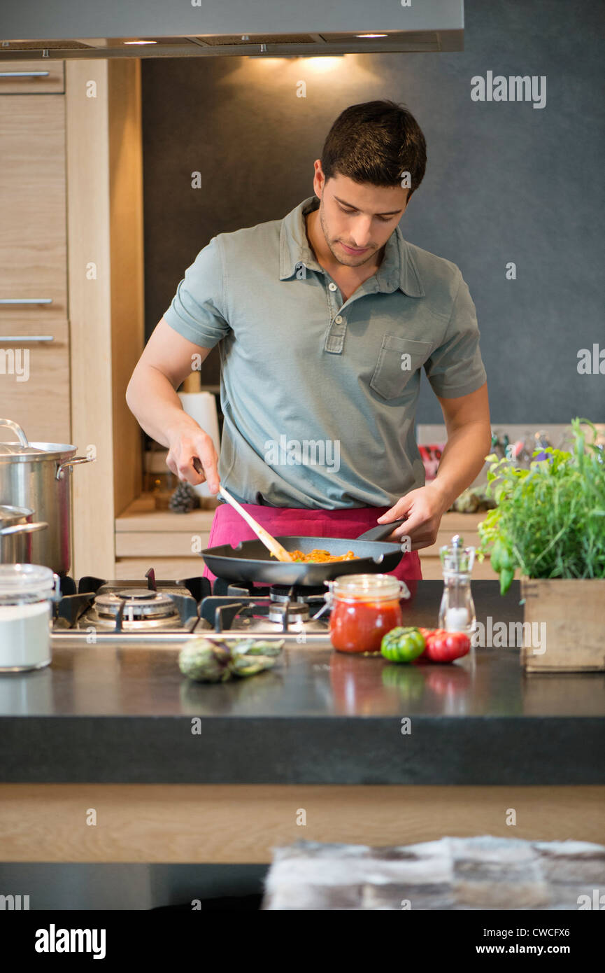 Man preparing food in the kitchen Stock Photo - Alamy