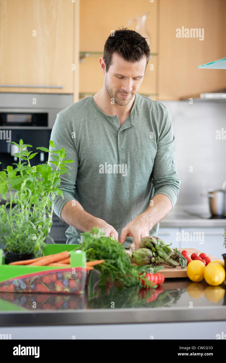Man preparing food in the kitchen Stock Photo - Alamy