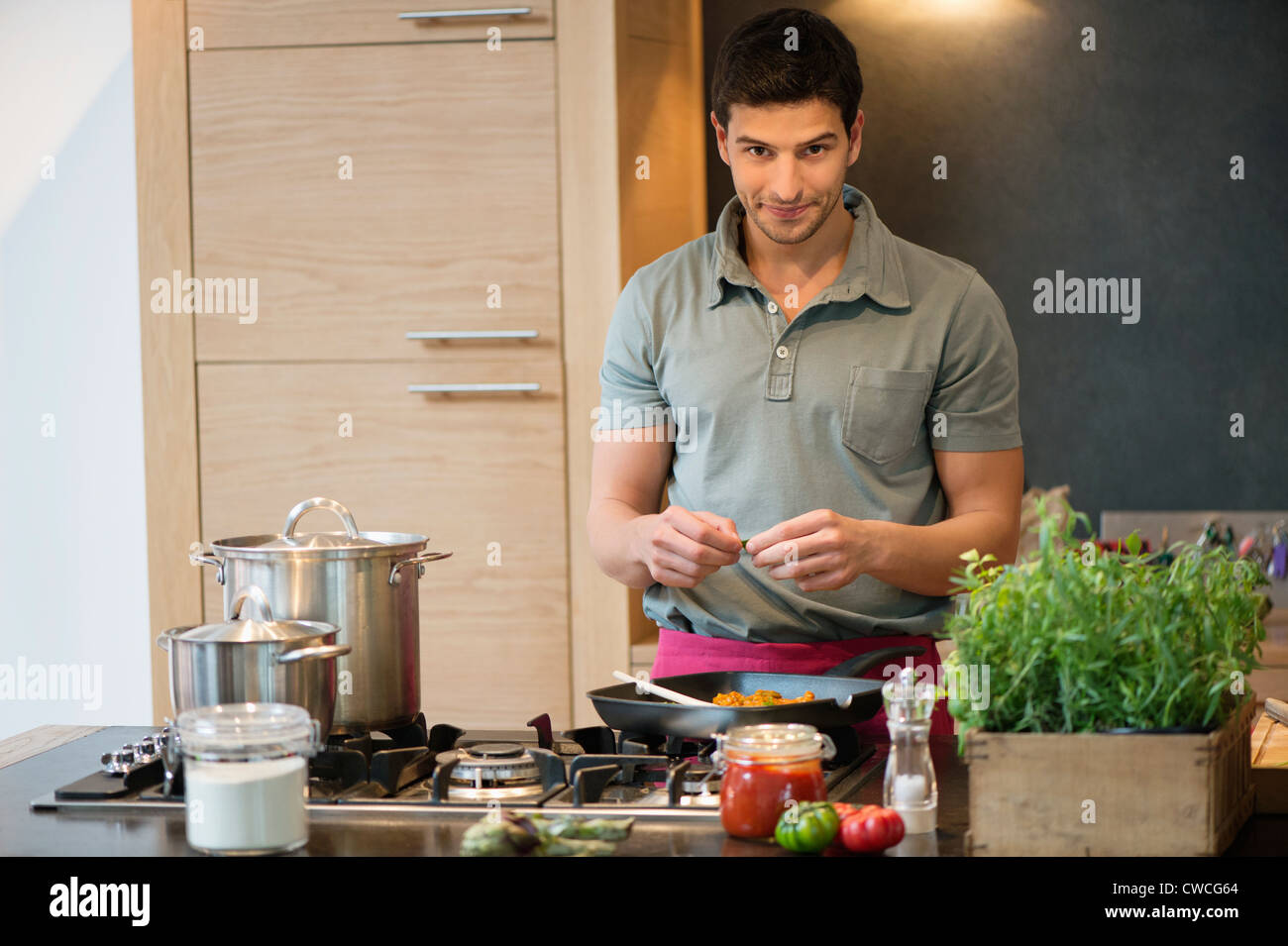 Man preparing food in the kitchen Stock Photo - Alamy