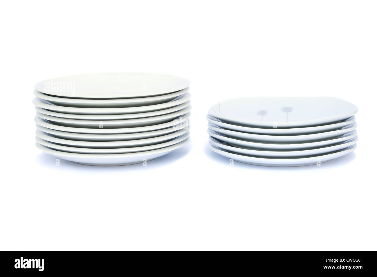 Stack of plates isolated on white background Stock Photo - Alamy