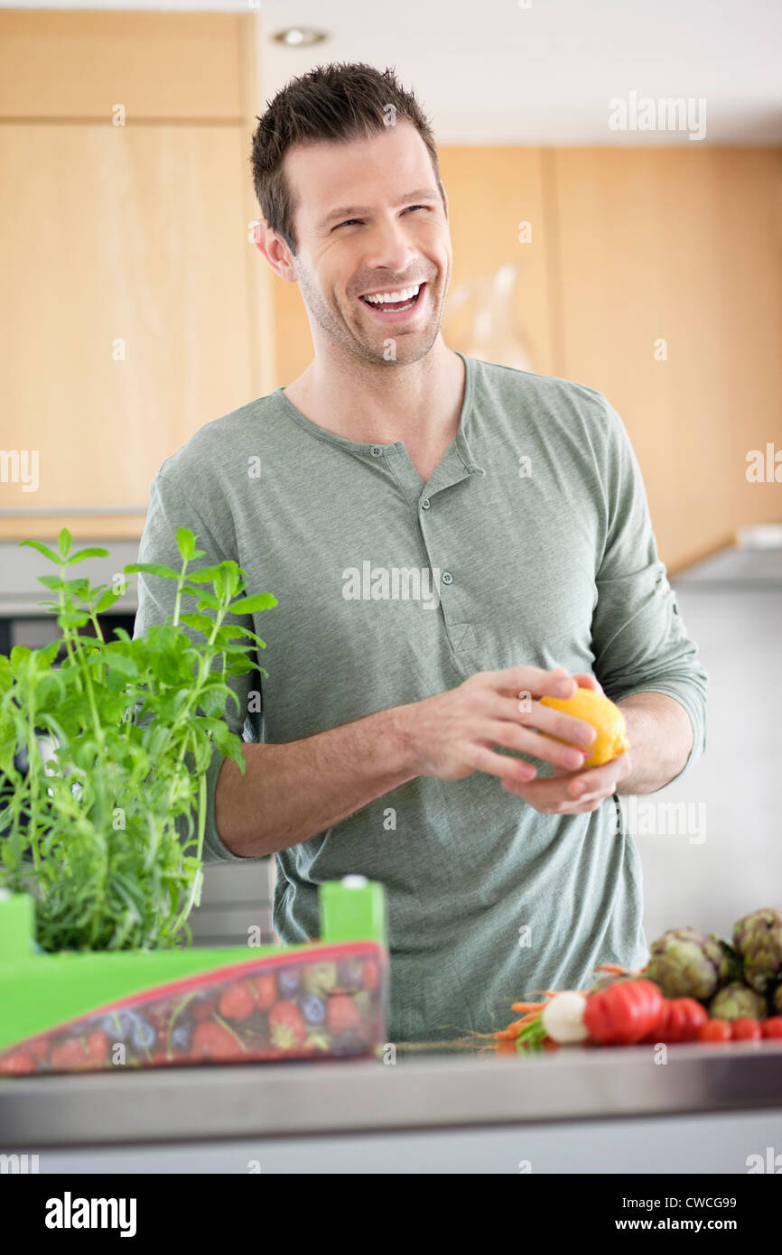 Man preparing food in the kitchen Stock Photo - Alamy