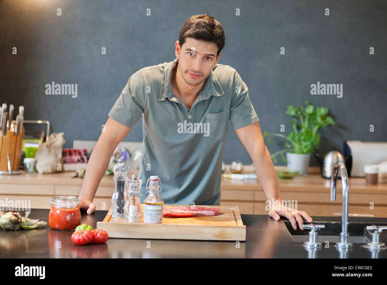 Man preparing food in the kitchen Stock Photo - Alamy