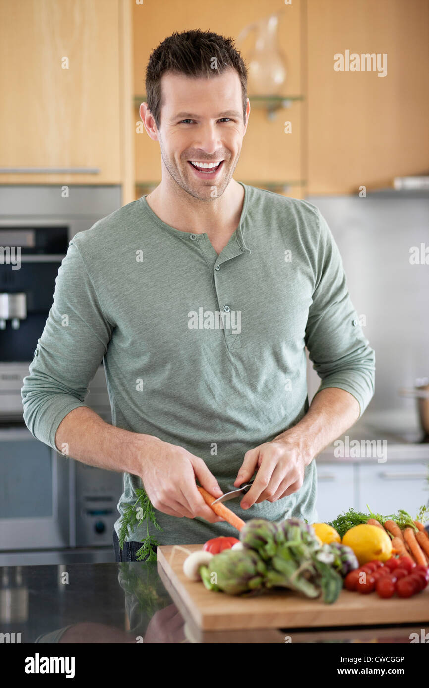 Man preparing food in the kitchen Stock Photo - Alamy
