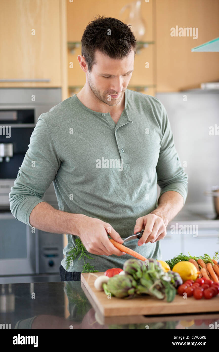 Man preparing food in the kitchen Stock Photo - Alamy
