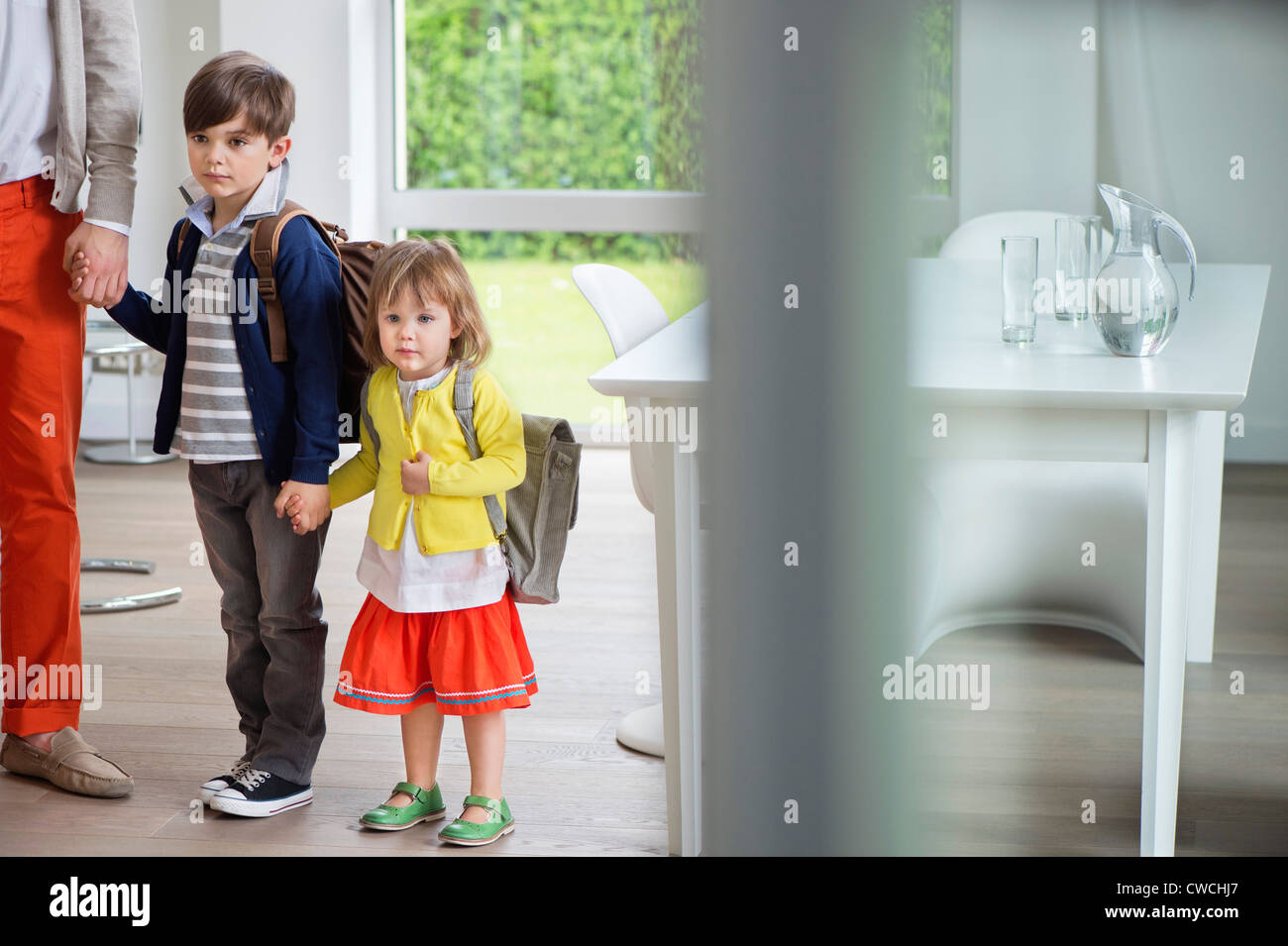 Children with their father leaving for school Stock Photo - Alamy