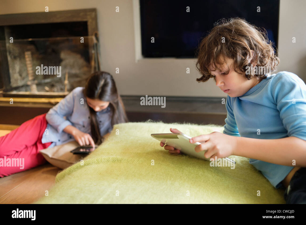 Family using electronic gadgets hi-res stock photography and images - Alamy