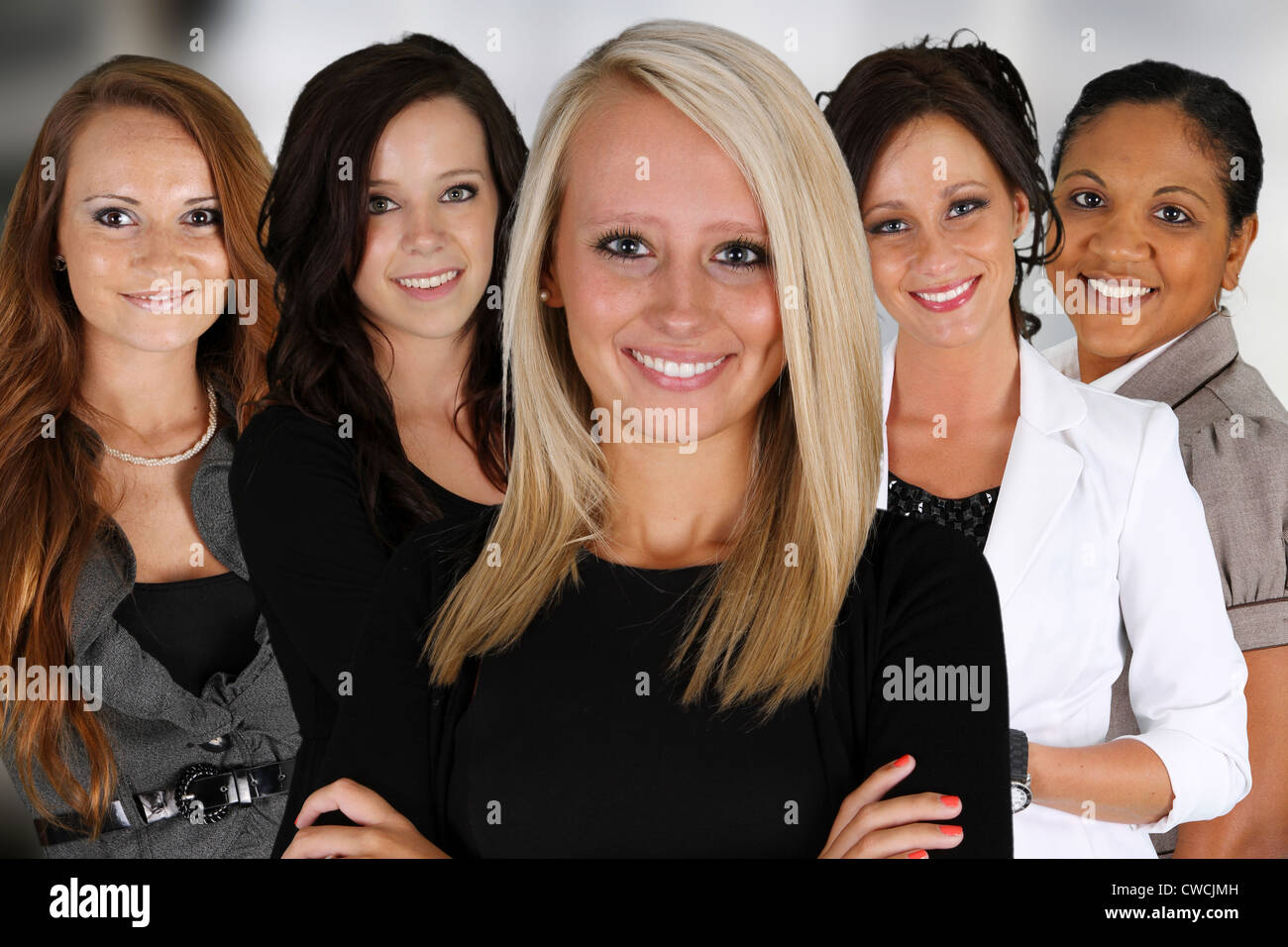 Businesswomen of all races working together in an office Stock Photo ...