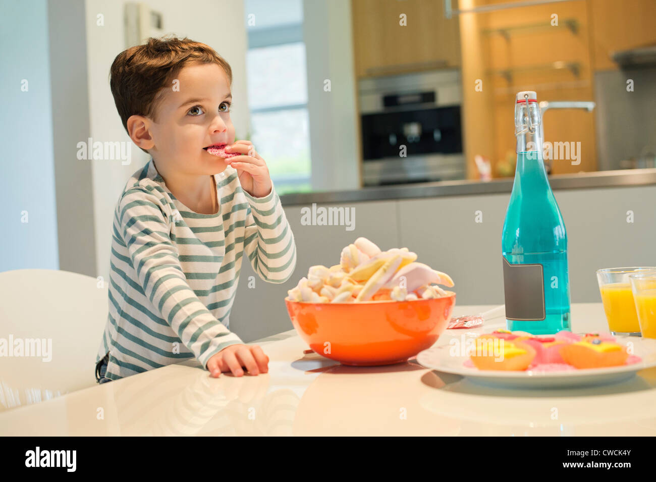 Boy eating snack Stock Photo - Alamy