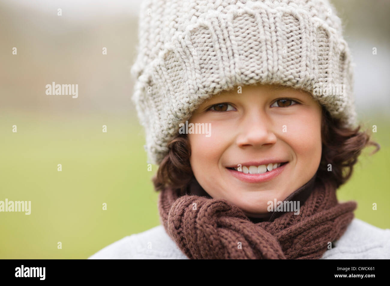 Portrait of a boy wearing a knit hat and smiling Stock Photo - Alamy