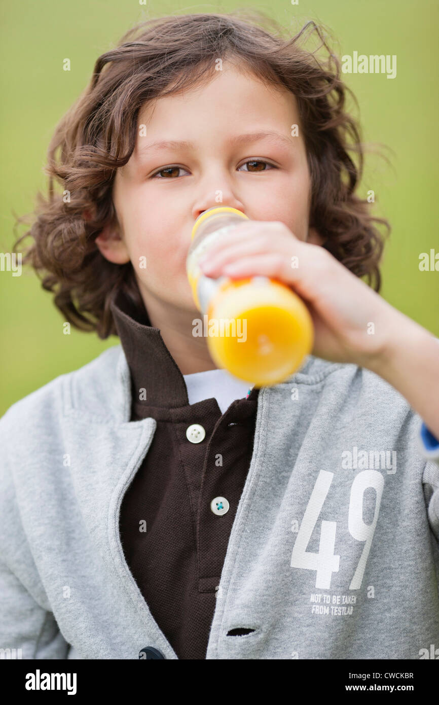 Portrait of a boy drinking juice Stock Photo - Alamy