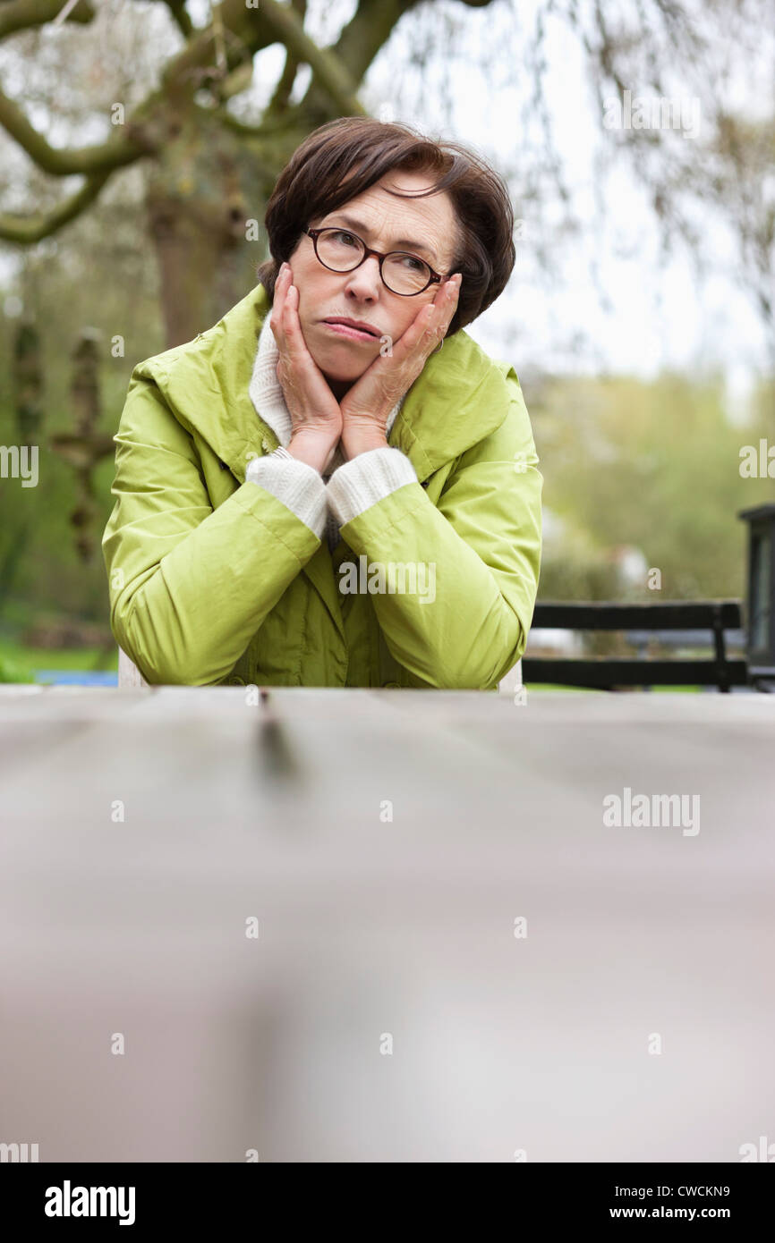 Woman lost in thoughts Stock Photo - Alamy