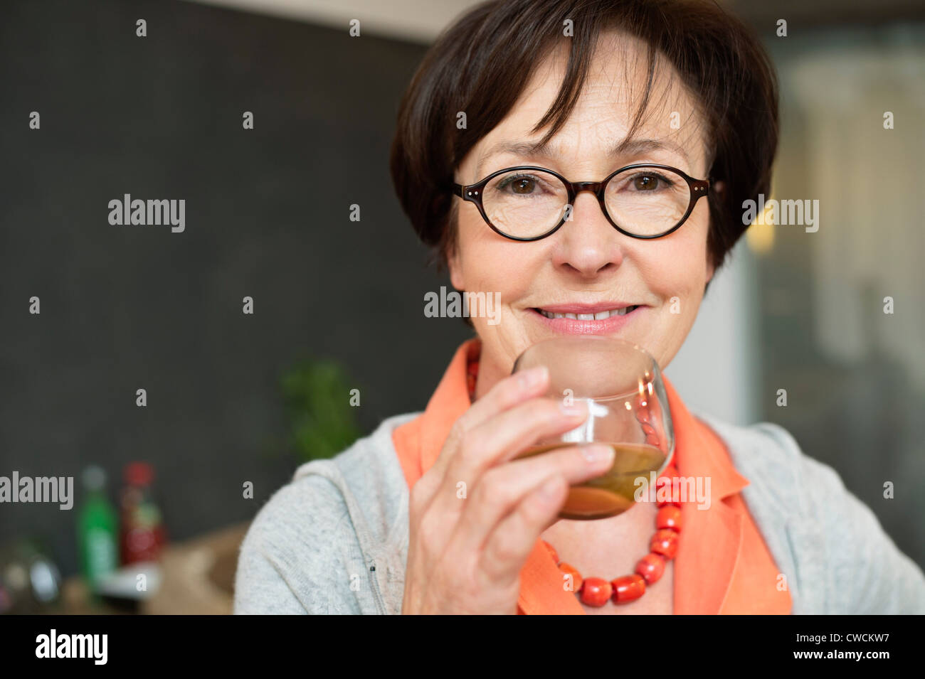 Woman drinking tea Stock Photo - Alamy