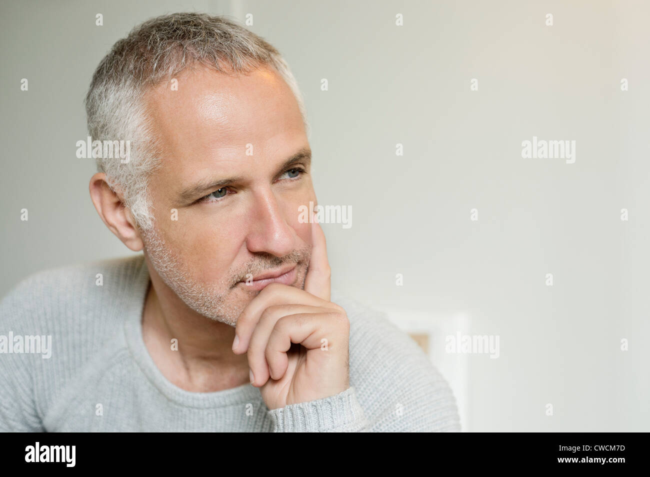 Close-up of a man thinking Stock Photo - Alamy