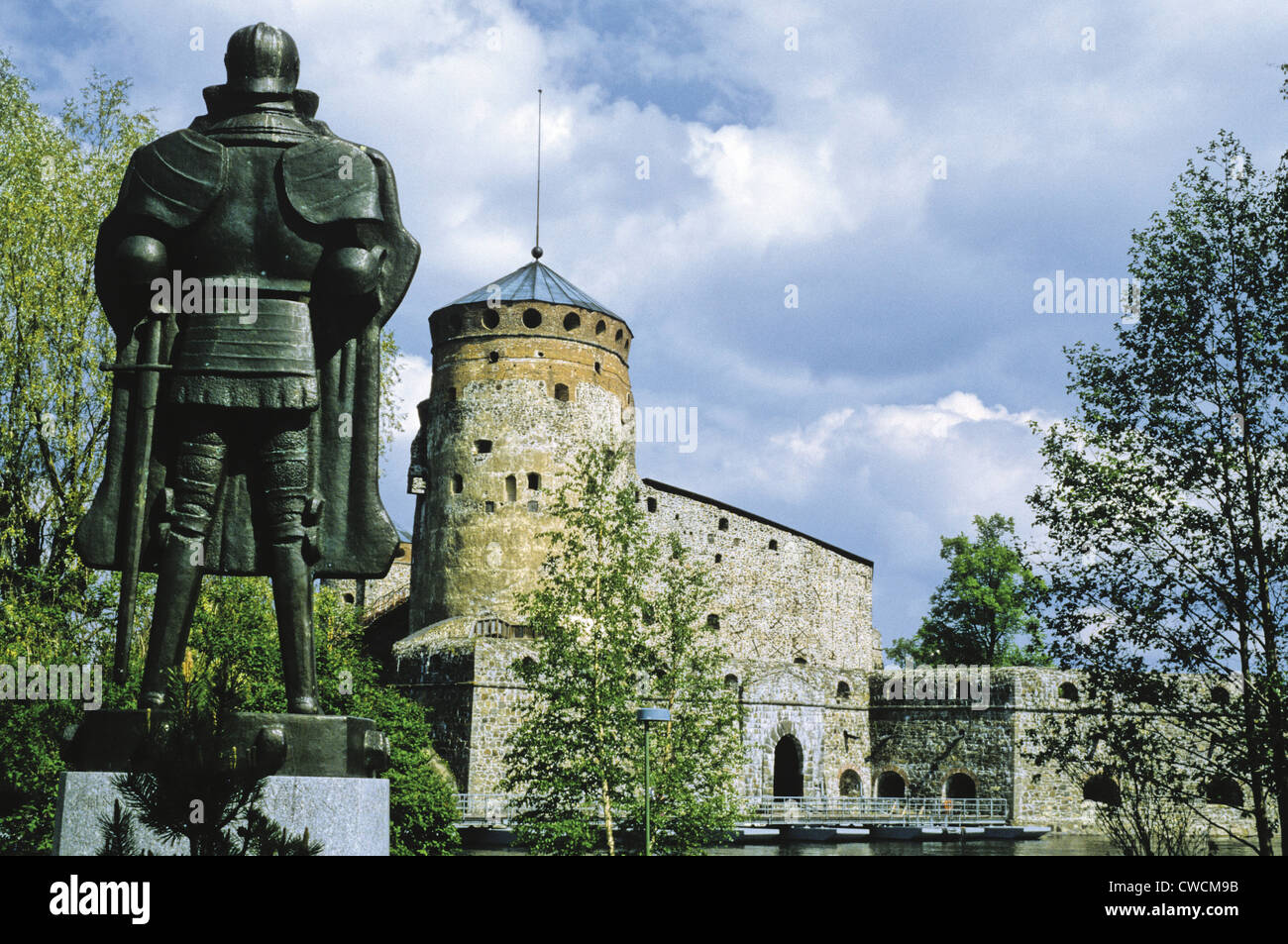 Medieval knight in armor outside Olavinlinna (St. Olaf’s Castle), a ...